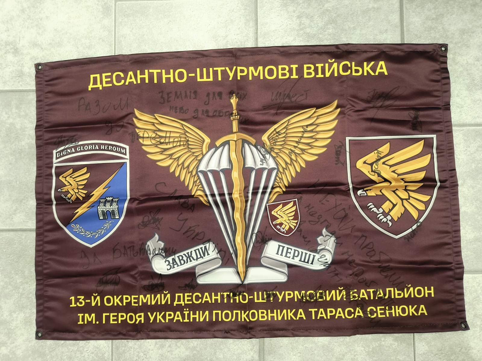 Ukrainian flag signed by fighters of 95th Air Assault Brigade with ...